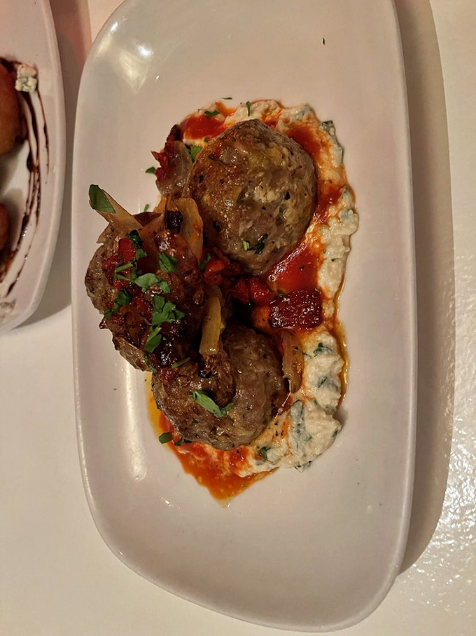 These aren't just meatballs&mdash;they're meaty islands in a sea of savory sauce, resting on clouds of creamy goodness that demand to be savored slowly.