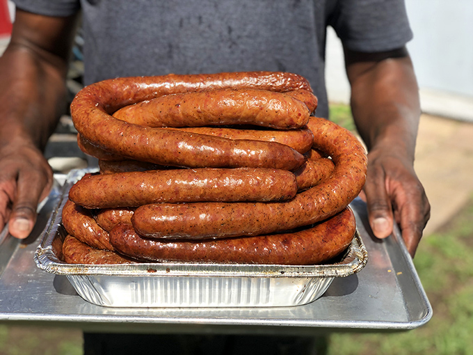 House-made sausage coiled like edible rope, ready to lasso your taste buds into smoky submission completely.