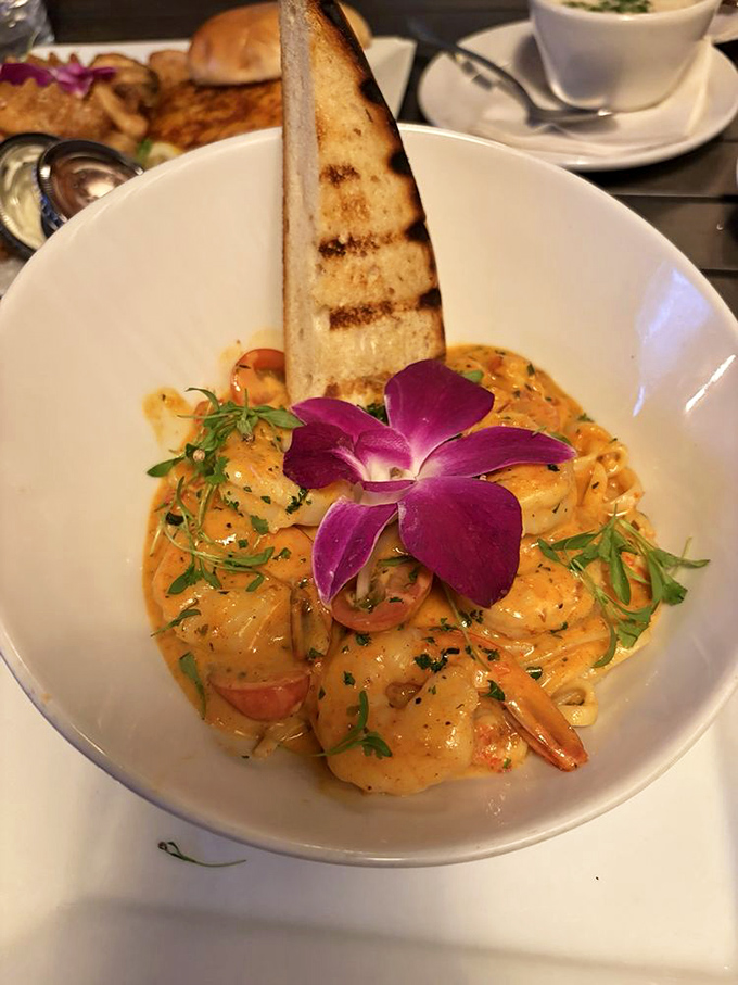 Saut&eacute;ed shrimp in a sunset-colored sauce, garnished with an edible purple flower&mdash;proof that sometimes the most beautiful art in Panama City isn't hanging in galleries.