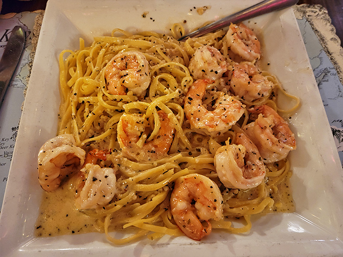 Shrimp scampi that makes you want to write poetry. Plump shrimp lounging in buttery, garlicky pasta like they're on vacation too.