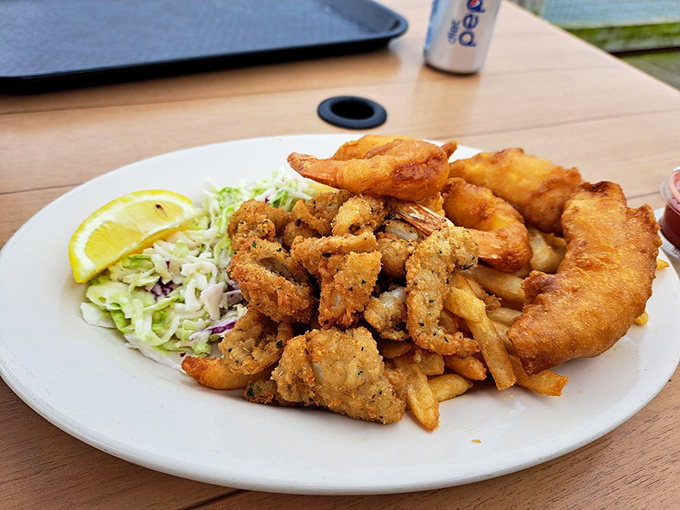 The seafood combo plate&mdash;where indecision becomes a virtue. Crispy, golden perfection with a side of "why choose just one?"
