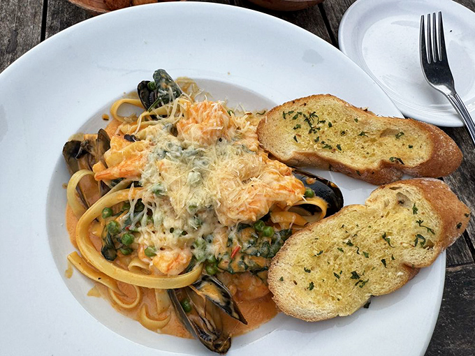 Seafood pasta that's having a party and invited all your favorite ocean dwellers. That garlic bread is definitely coming home with you.