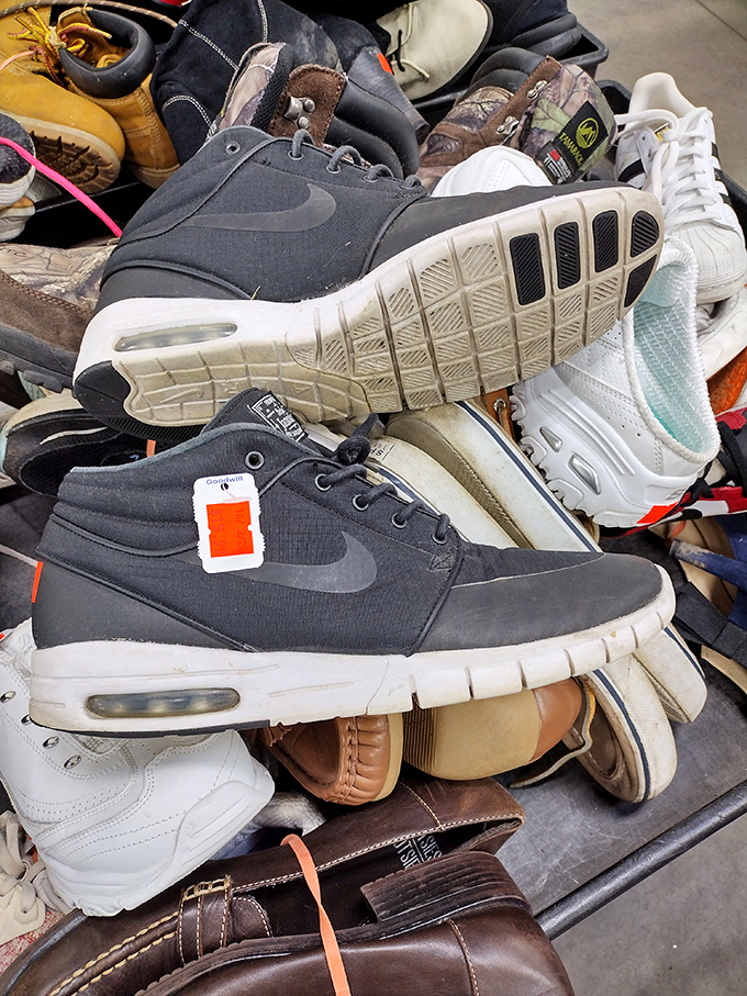 Nike sneakers nestled among work boots&mdash;each with stories to tell and miles left to travel on someone else's journey. 