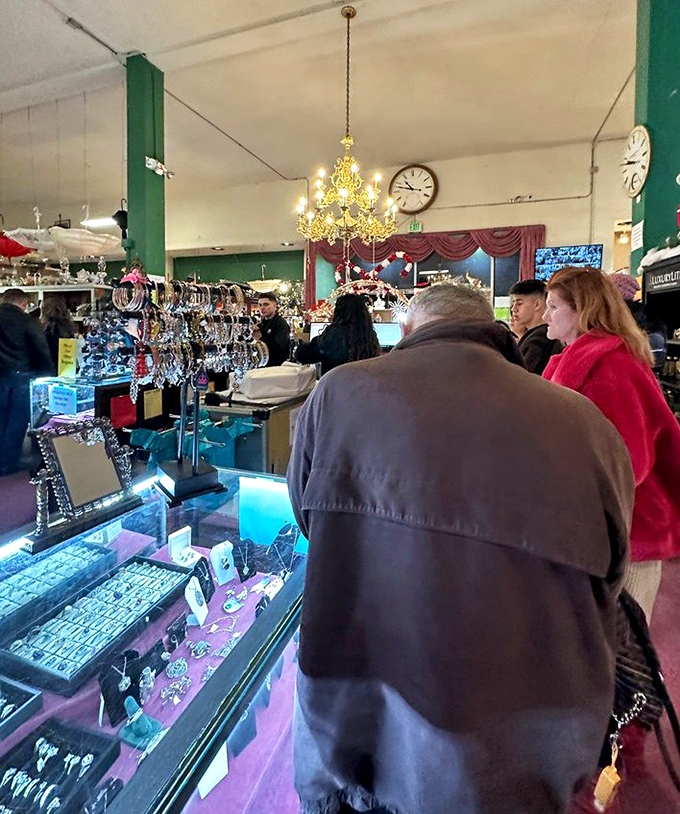 Treasure hunters in their natural habitat, scanning glass cases with the focused determination of archaeologists who prefer air conditioning to desert heat.