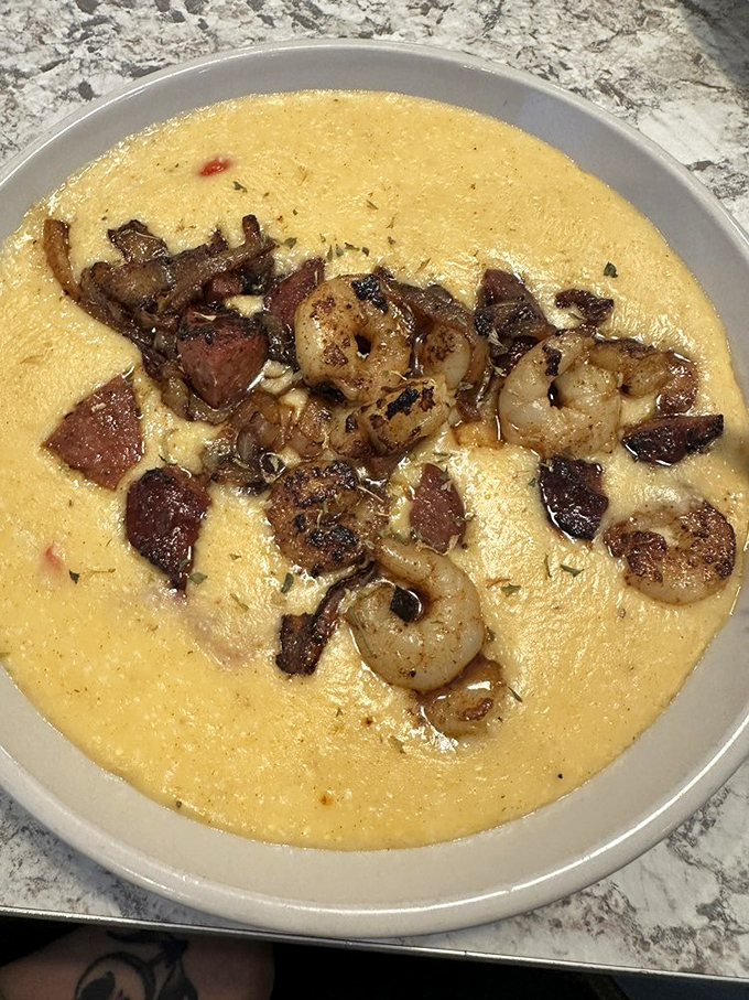 Creamy grits cradle perfectly seasoned shrimp in this Southern classic. Comfort food that hugs you from the inside out.
