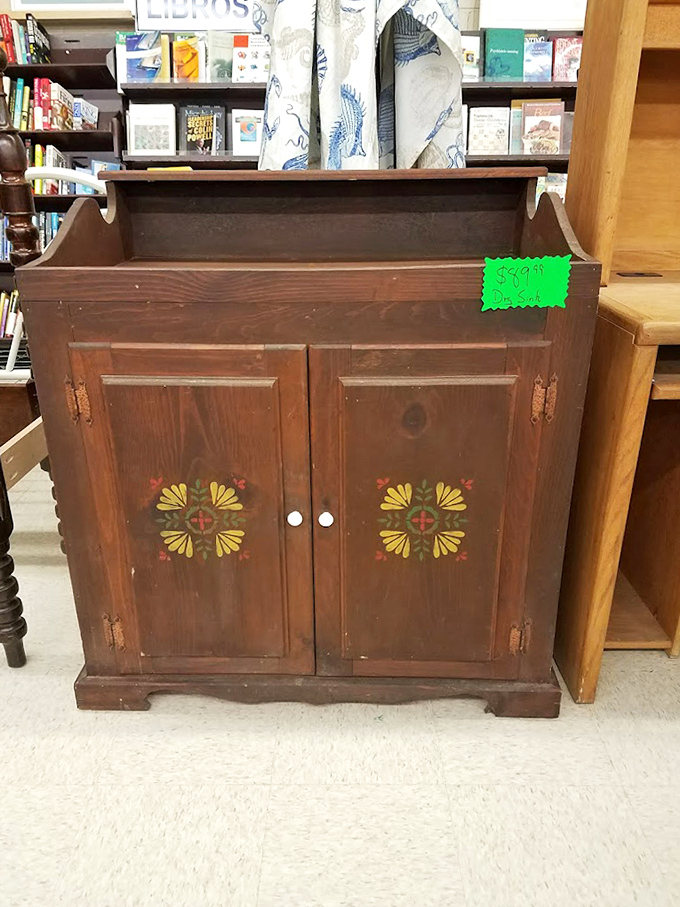 This charming vintage cabinet with folk art details is practically begging to display your grandmother's china collection.