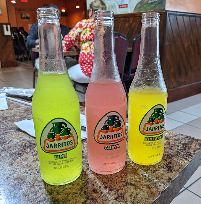 Jarritos sodas in their technicolor glory – lime, guava, and pineapple flavors that transport you straight to a Mexican mercado.