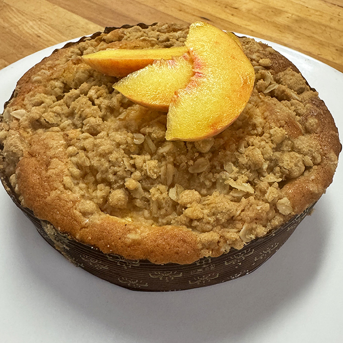 A peach-topped crumb cake that doesn't just whisper "summer"&mdash;it belts out a full seasonal anthem with buttery, streusel-topped enthusiasm.