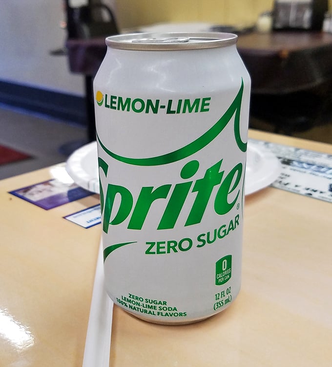 Even the soda feels nostalgic here, where every sip of fizzy refreshment is the perfect counterpoint to the savory symphony on your plate.