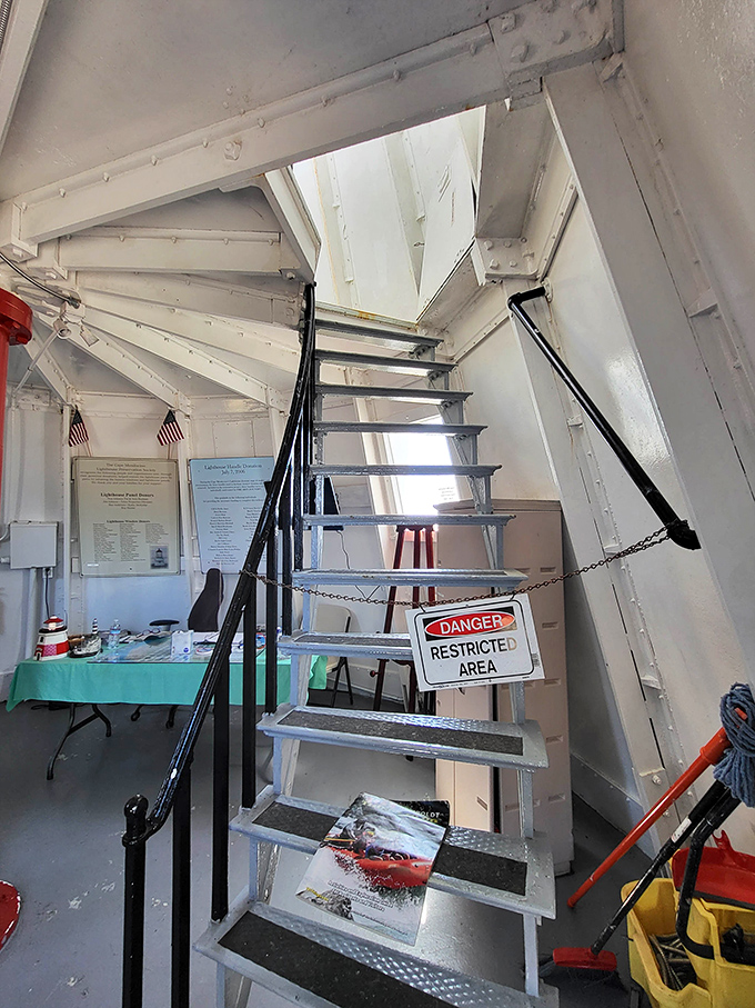 "Danger: Restricted Area" signs add a touch of mystery to these metal stairs. What lighthouse secrets wait at the top?