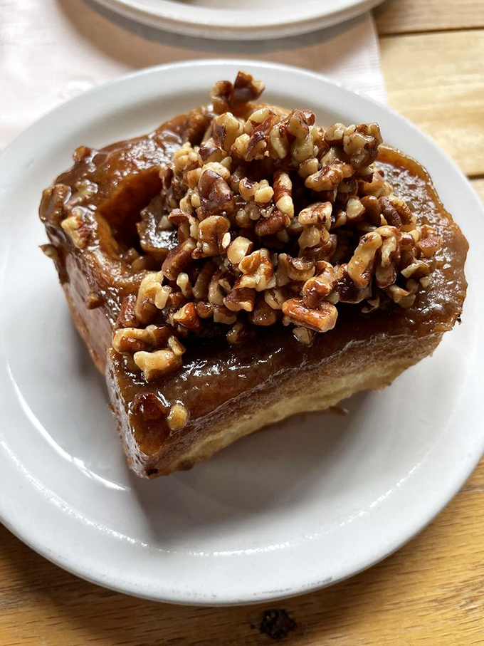 Not just a sticky bun, but a monument to decadence with caramelized edges and a walnut crown fit for pastry royalty.