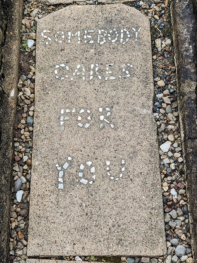 Stone messages speak louder than words, sharing wisdom embedded in this remarkable folk art garden.