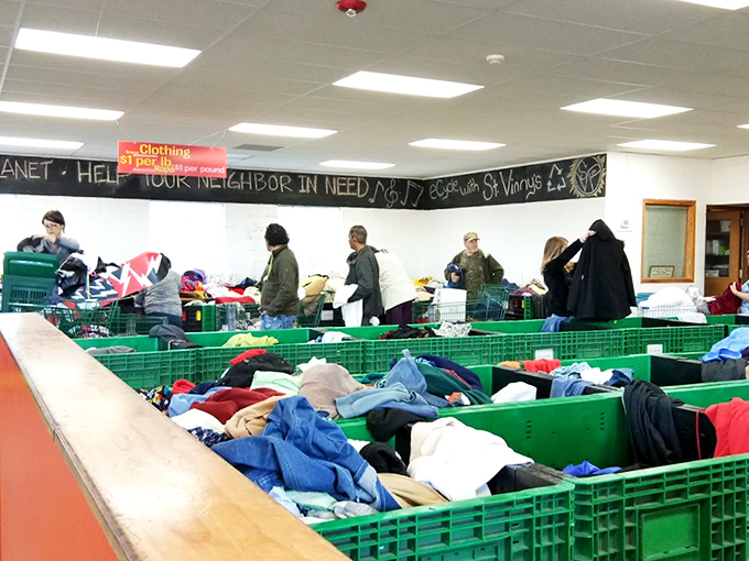 Treasure hunters in their natural habitat, methodically working through the textile terrain. The thrill of the hunt is universal.