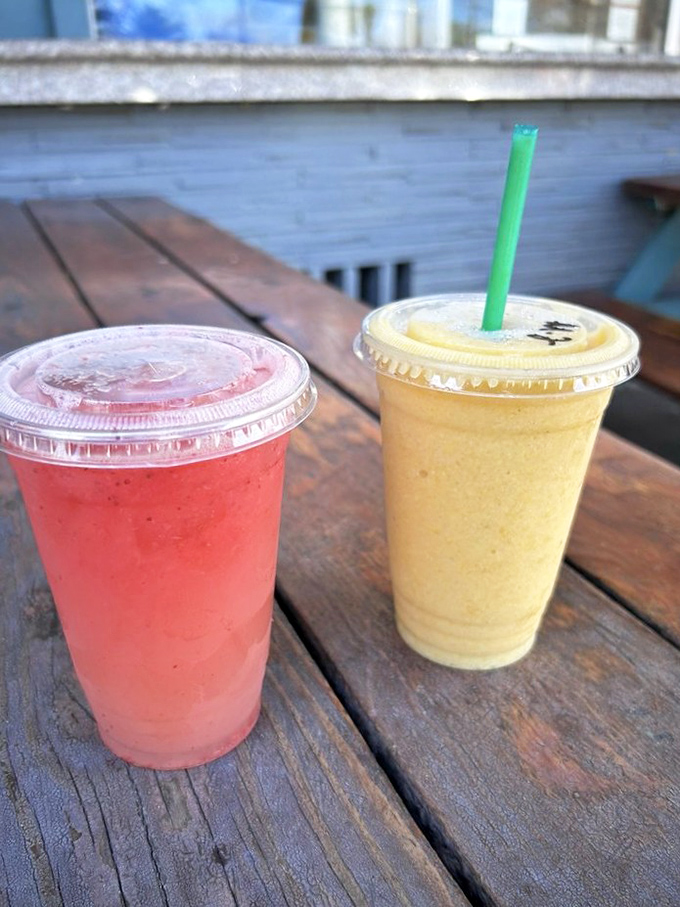 Summer captured in plastic cups. One sip of these vibrant smoothies, and suddenly that kale cleanse you were planning seems unnecessarily punitive. 