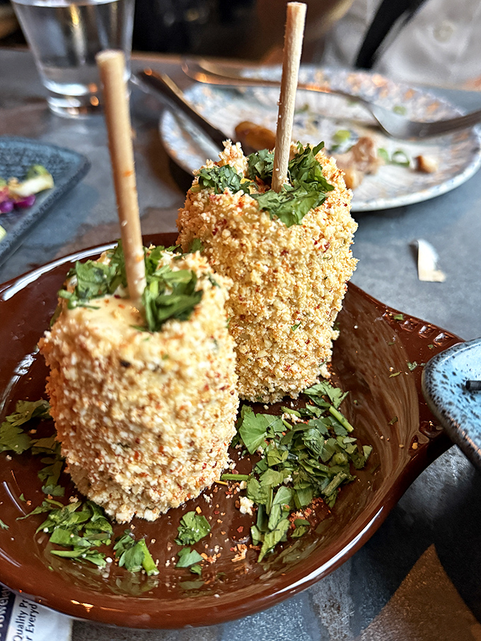 Street corn elevated to art form &ndash; these golden-crusted corn fritters on sticks are what carnival food dreams of becoming when it grows up.