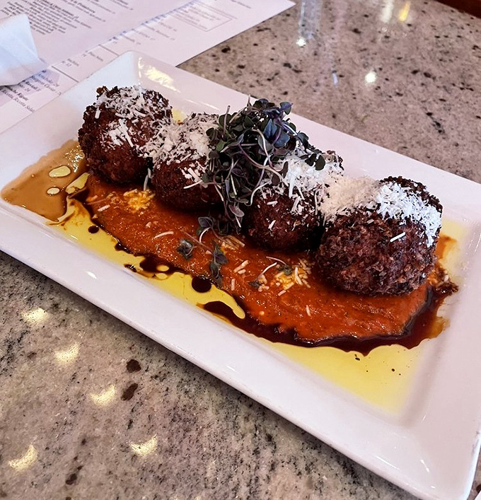 These risotto fritters represent everything wonderful about Italian creativity meeting American appetite for indulgence.
