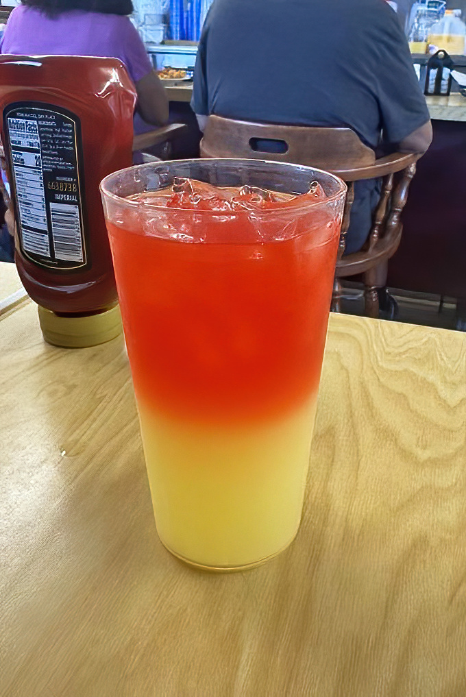 The sunset drink creates a beautiful gradient that's almost too pretty to sip, but resistance is futile.