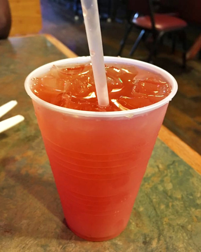 The mysterious Swamp Juice cocktail glows with tropical promise. Like Florida in a cup&mdash;sweet, punchy, and not afraid of color.