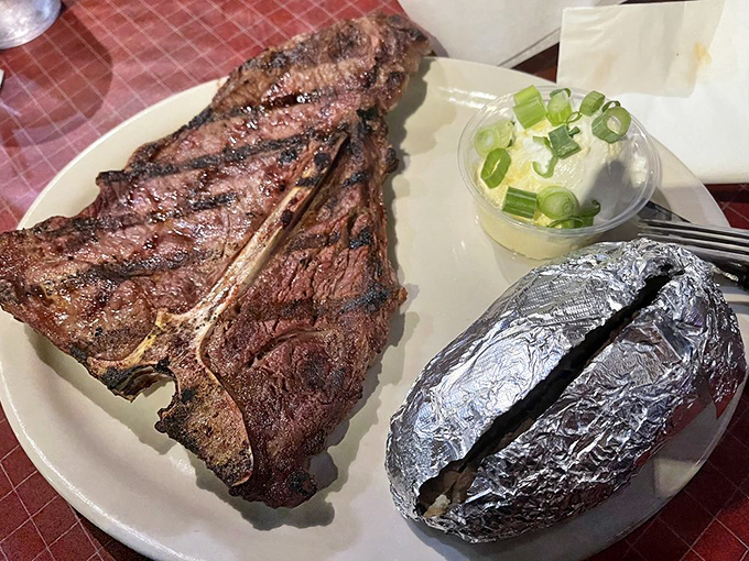 The T-bone presents the age-old dilemma: start with the strip side or the filet? It's like choosing between chocolate and vanilla when both are spectacular.