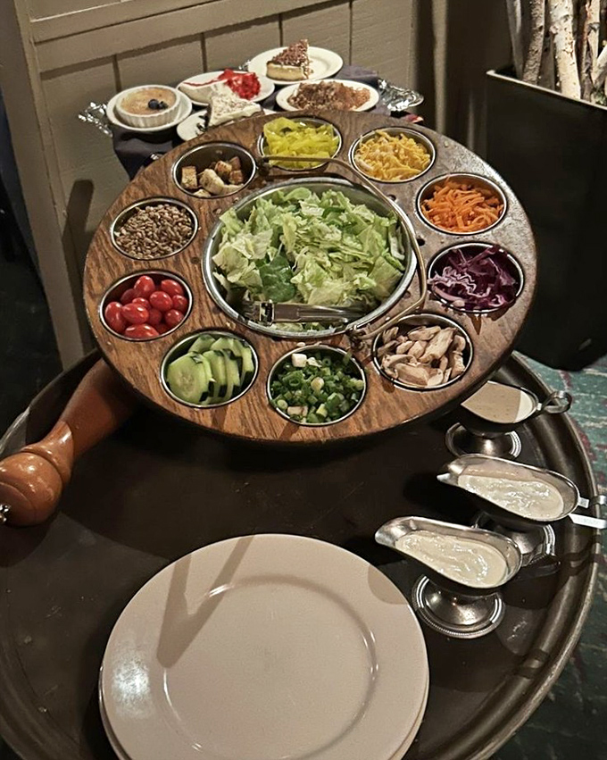 The tableside salad cart is dinner theater at its finest. Fresh ingredients arranged like a colorful wheel of fortune where every spin wins. 