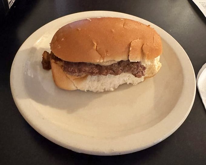 The Texas Hamburger &ndash; where beef meets that legendary chili sauce in a union so perfect it should have its own anniversary celebration.