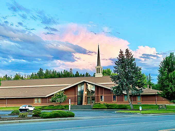 Faith finds architectural expression against perfect blue skies. Sunday best meets everyday spirituality in structures that anchor the community. 