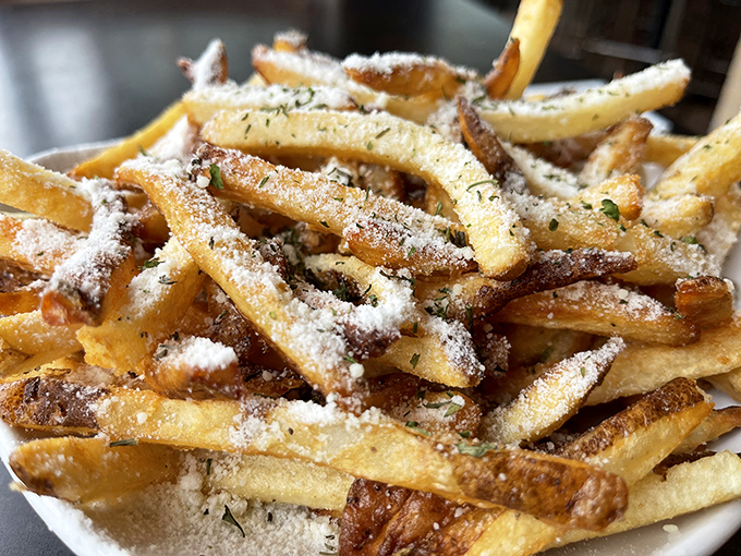 Hand-cut fries elevated with truffle oil create the kind of indulgence that justifies any calorie count.