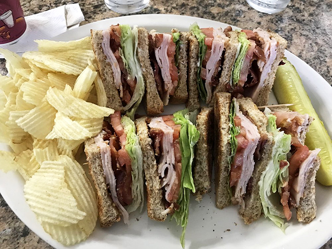 The club sandwich&mdash;architecture you can eat. These layers deserve their own blueprint, with each story more delicious than the last.
