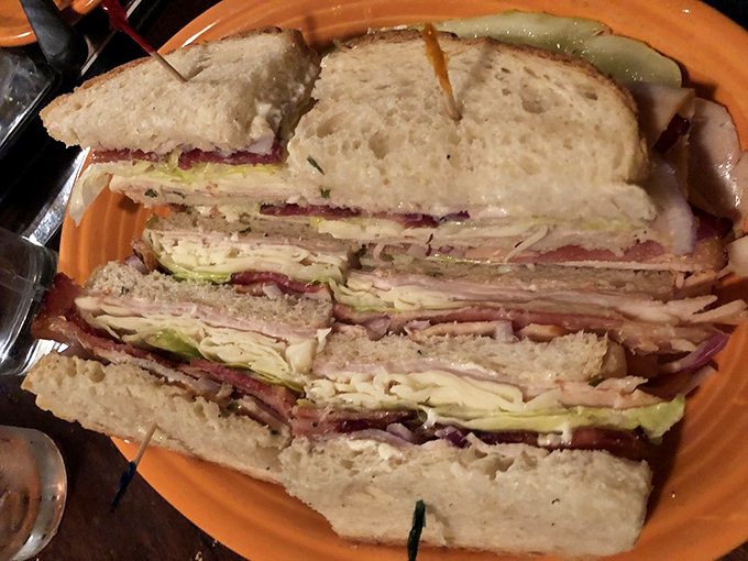 This isn't just a sandwich; it's an architectural marvel. The turkey club that makes you wonder if you should unhinge your jaw like a snake.