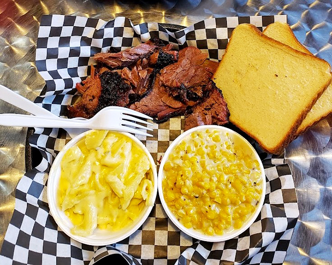 The two-meat plate with mac and corn &ndash; a trilogy more satisfying than most Hollywood franchises. Yellow sides frame the smoky star.