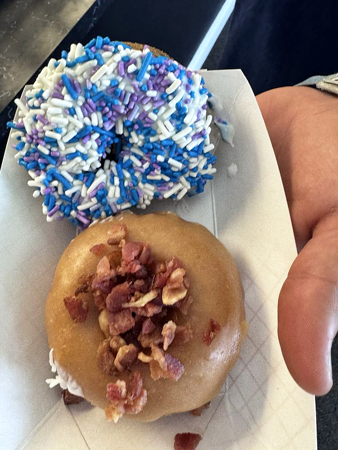 The maple bacon donut: proof that breakfast foods were always destined to unite. Its blueberry companion looks on in sprinkled splendor.