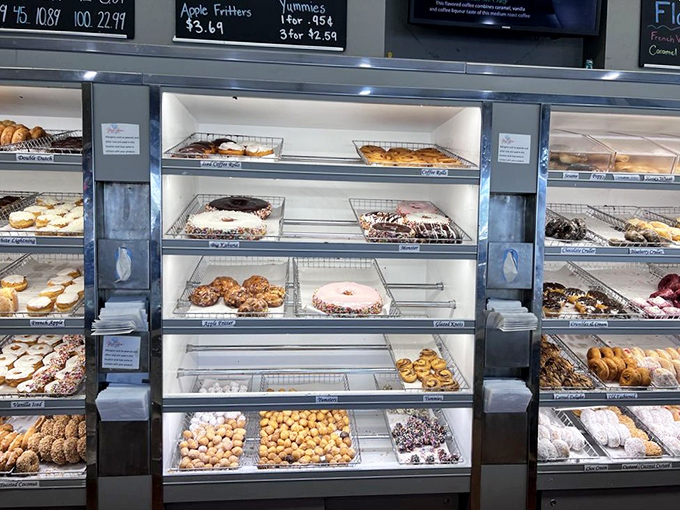 The display case at Yum Yum isn't just a showcase &ndash; it's a museum of edible art where each shelf tells a different chapter in the story of breakfast bliss.