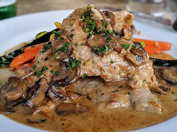 Veal bathing in mushroom cream sauce that makes you want to lick the plate when nobody's looking&mdash;though everyone's thinking the same thing.