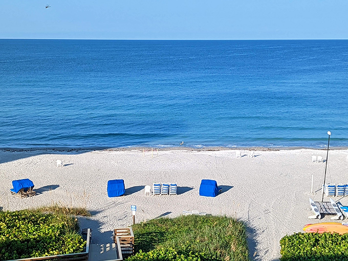 White sand beaches with blue cabanas—nature's perfect answer to the question "What does relaxation look like?"