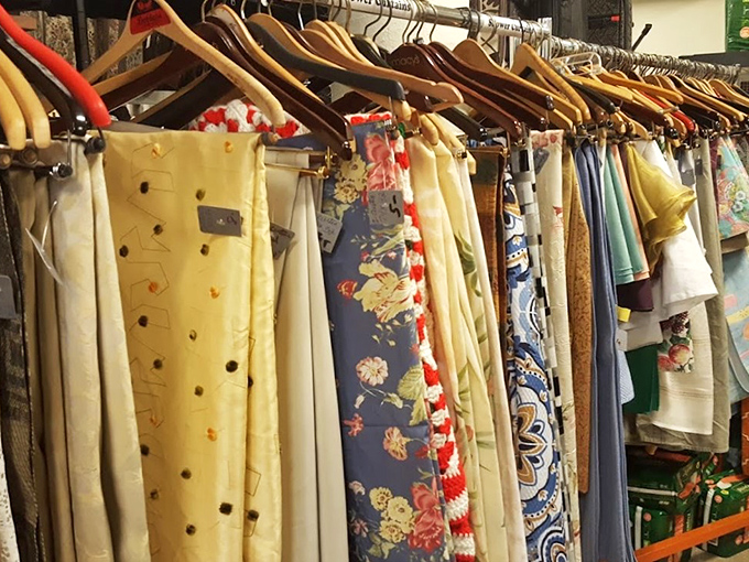 Fabric treasures hanging like colorful flags of fashion past. Each pattern tells a story&mdash;some more loudly than others.