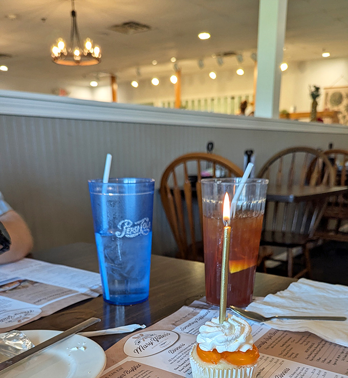 Even the beverages get special treatment at Mary Yoder's, with that birthday cupcake stealing the spotlight like a diva on dessert row.