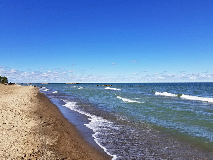 Lake Erie shows off its playful side with waves that dance toward shore, reminding visitors this is no ordinary lake.