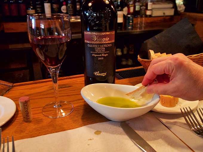 The sacred Italian ritual: good wine, golden olive oil, crusty bread. Sometimes the simplest pleasures are the most profound.