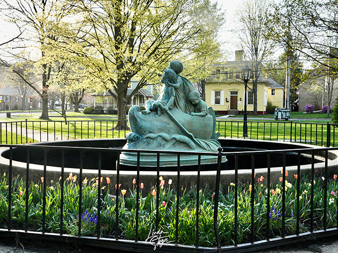 The Wynken, Blynken, and Nod statue surrounded by spring tulips brings a beloved children's poem to life, proving literature deserves more fountains in its honor.