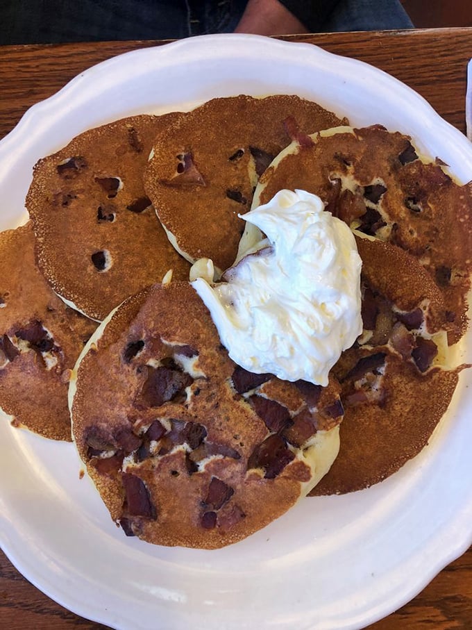 Chocolate chip pancakes topped with a cloud of whipped cream &ndash; breakfast masquerading as dessert, and nobody's complaining.