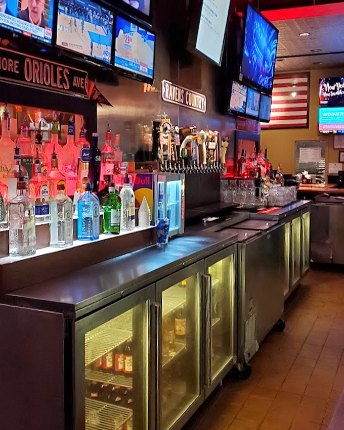 The bar area—where Maryland sports loyalties are displayed as proudly as the impressive lineup of spirits waiting to celebrate victories or console defeats.