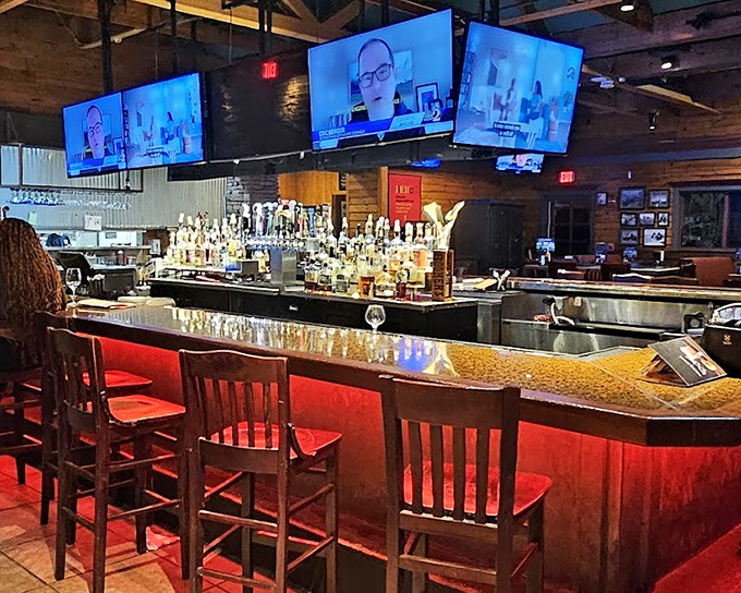 The bar at Smokey Bones doesn't just serve drinks; it creates a community gathering spot where strangers become friends over bourbon and barbecue debates.