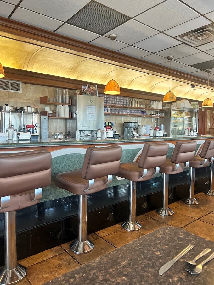 The counter seating &ndash; where solo diners become regulars, coffee cups are never empty, and the world's problems are solved one breakfast special at a time.