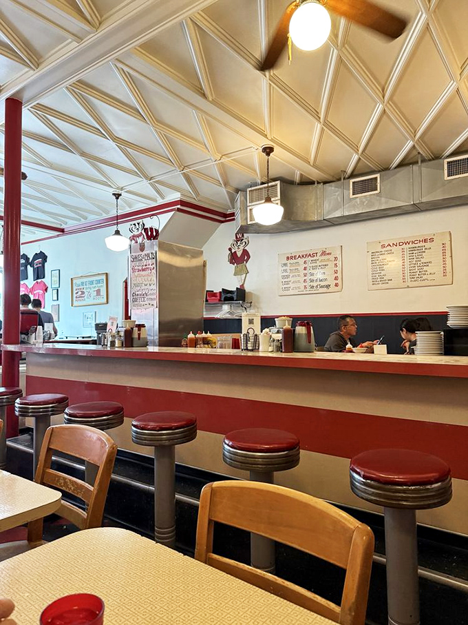 Classic counter seating where strangers become temporary neighbors, sharing nothing but space and the universal language of "mmm, that's good."