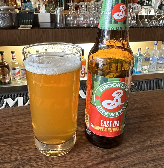 Brooklyn Brewery's East IPA looking photogenic beside its half-empty glass. The relationship status between beer and burger: "It's complicated." 