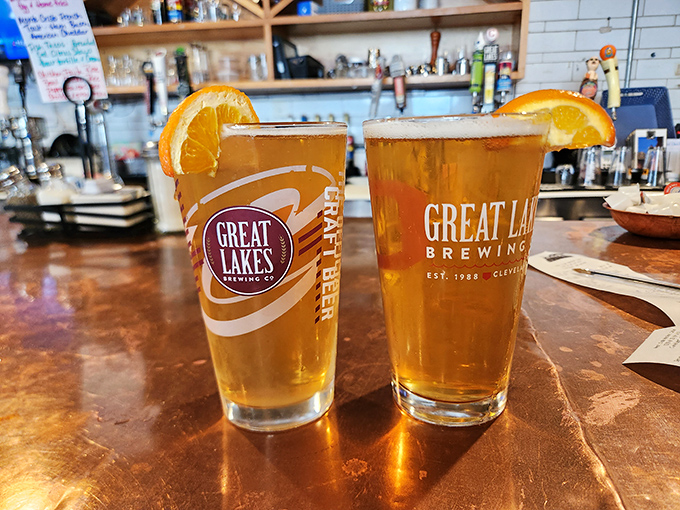 Great Lakes brews with orange slices perched on the rim &ndash; liquid sunshine in a glass after a morning of market exploration.