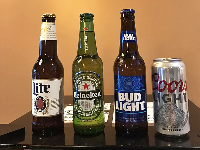 The beer lineup stands at attention, ready to cool the heat from your spicy seafood boil—liquid reinforcements for your culinary adventure.