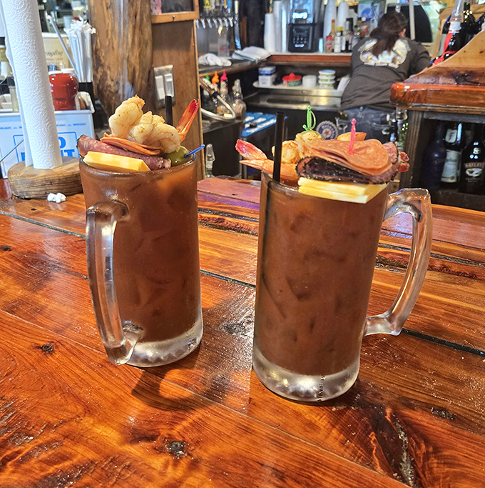 Bloody Marys topped with shrimp&mdash;because drinking your vegetables is better when seafood is involved. Breakfast of champions or lunch of legends?