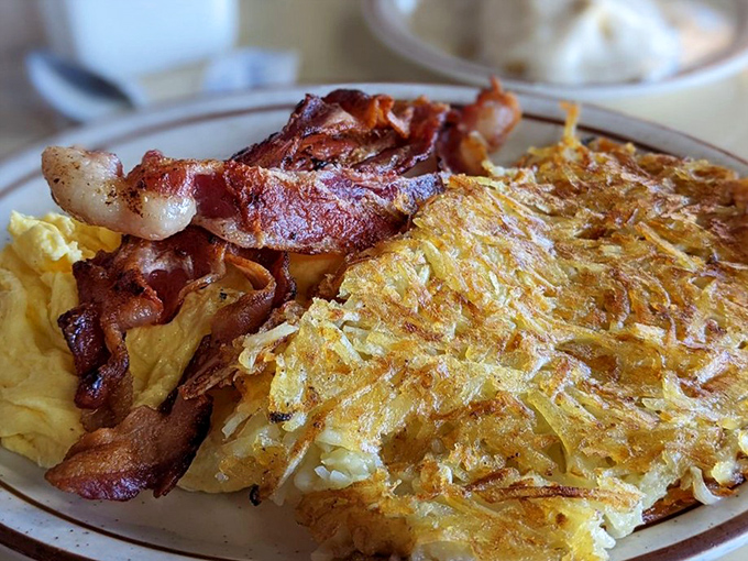 Crispy hash browns that crackle with each bite, eggs cooked just right, and bacon that's achieved that mythical balance between crispy and chewy.