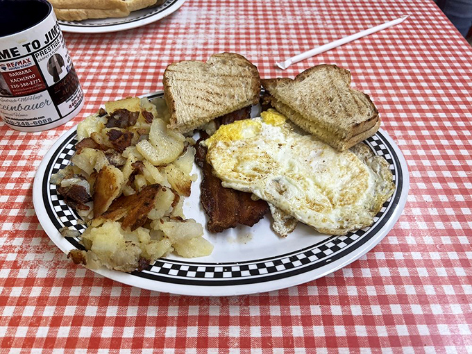 Simple perfection: golden home fries, eggs with just-right yolks, and toast waiting for its butter bath. Sometimes classics need no improvement.